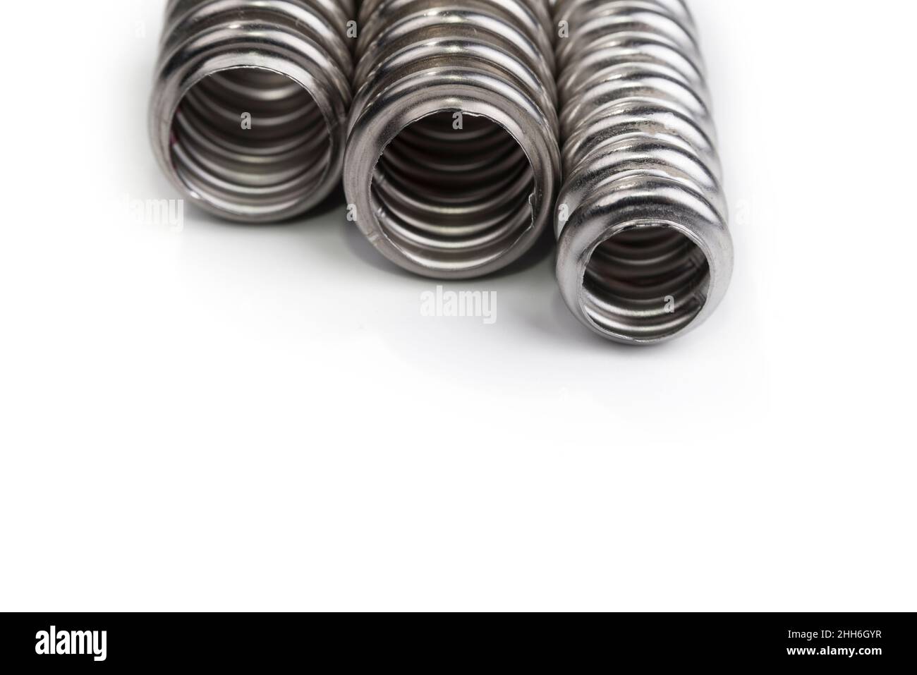 Steel flexible hoses for a boiler on a white Stock Photo - Alamy