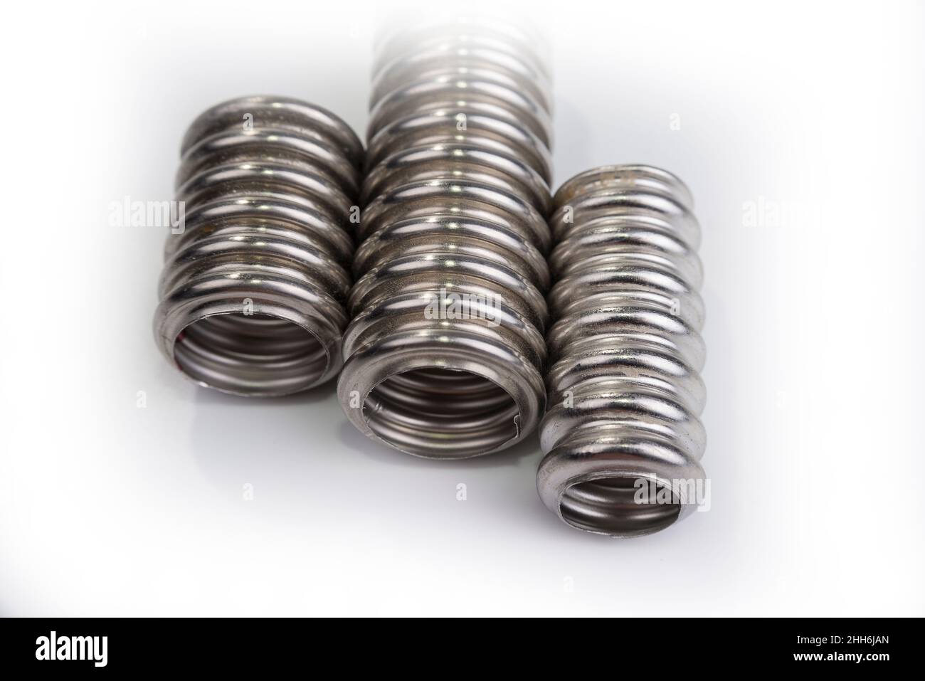 Steel flexible hoses for a boiler on a white Stock Photo - Alamy