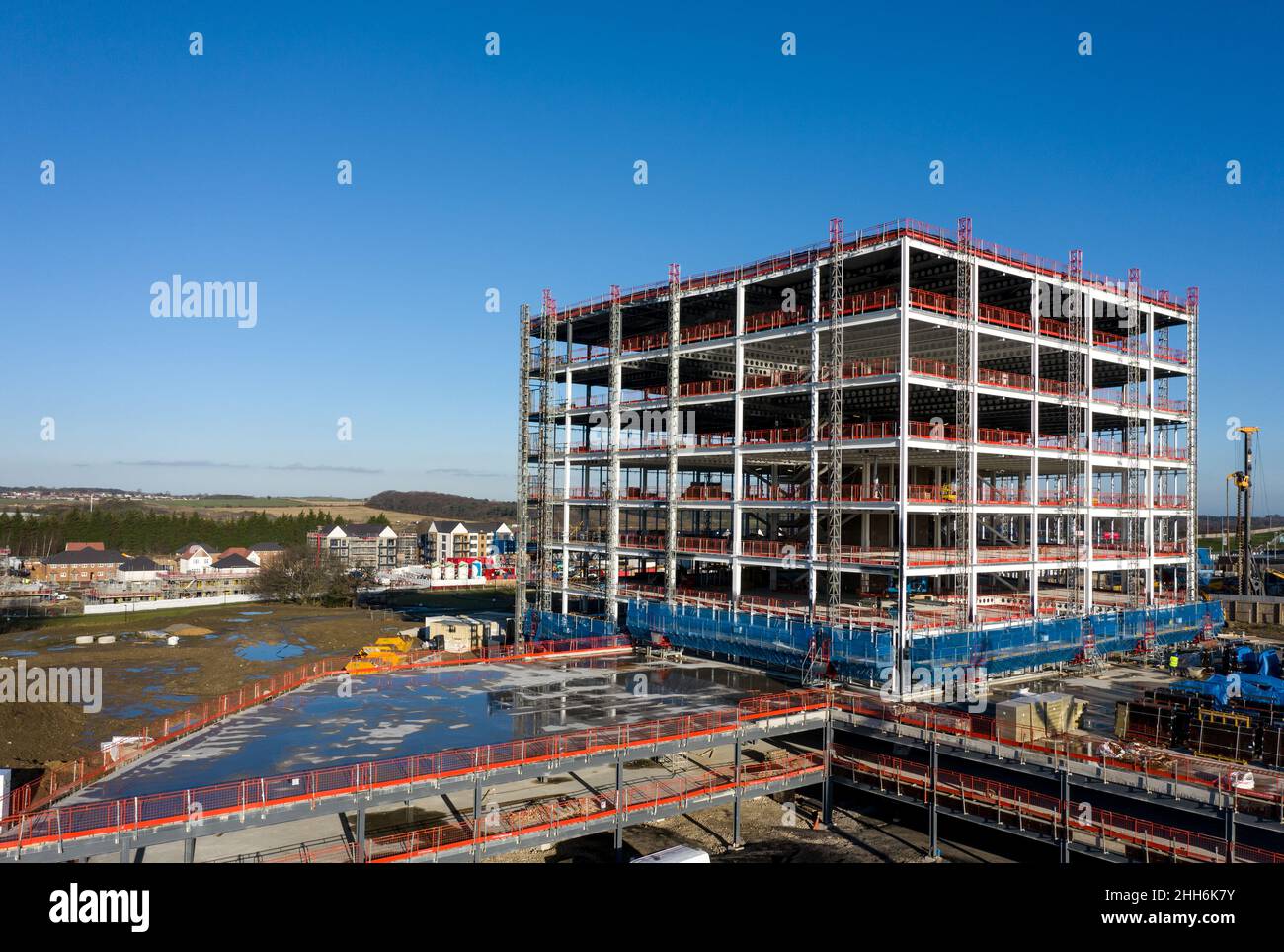 A tower block metal frame building being built on a construction site ...
