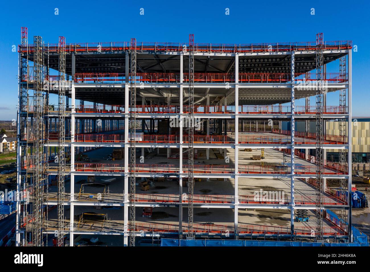 A tower block metal frame building being built on a construction site ...