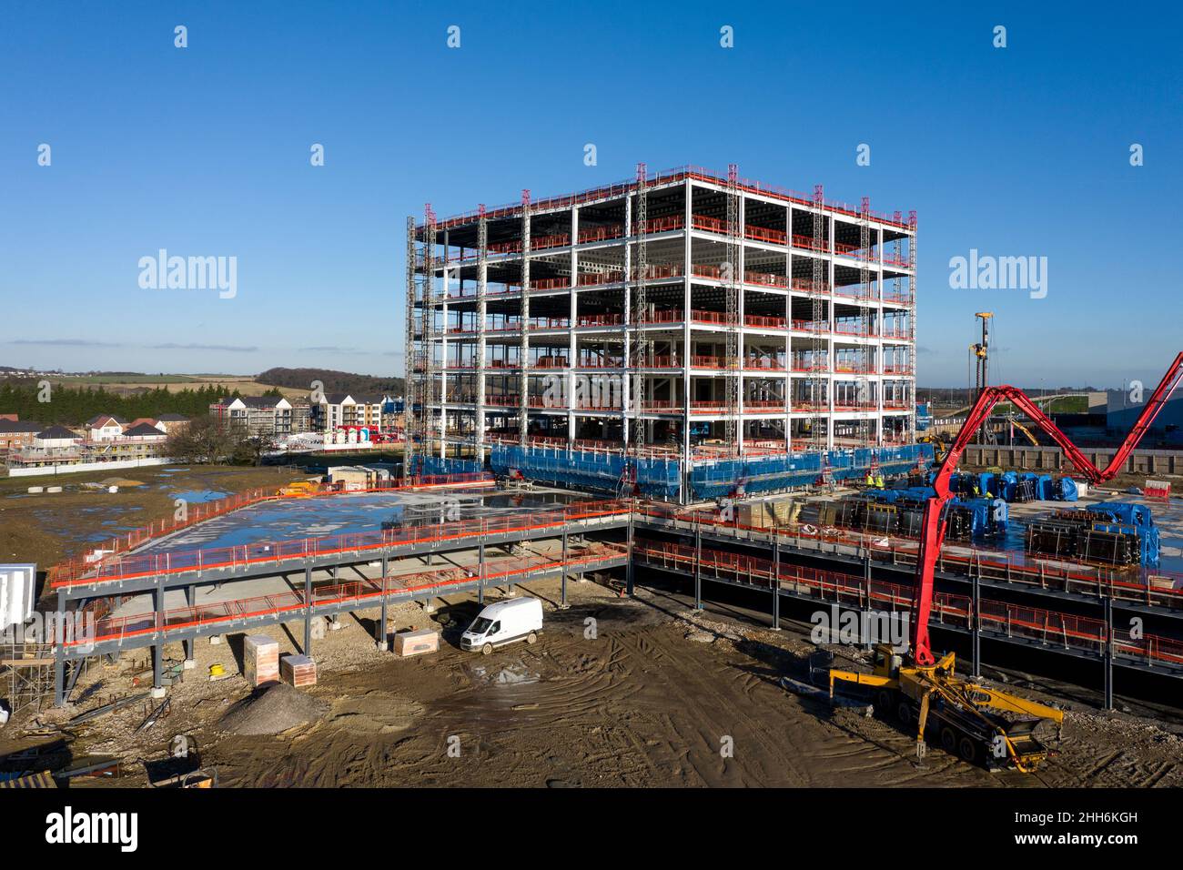 A tower block metal frame building being built on a construction site ...