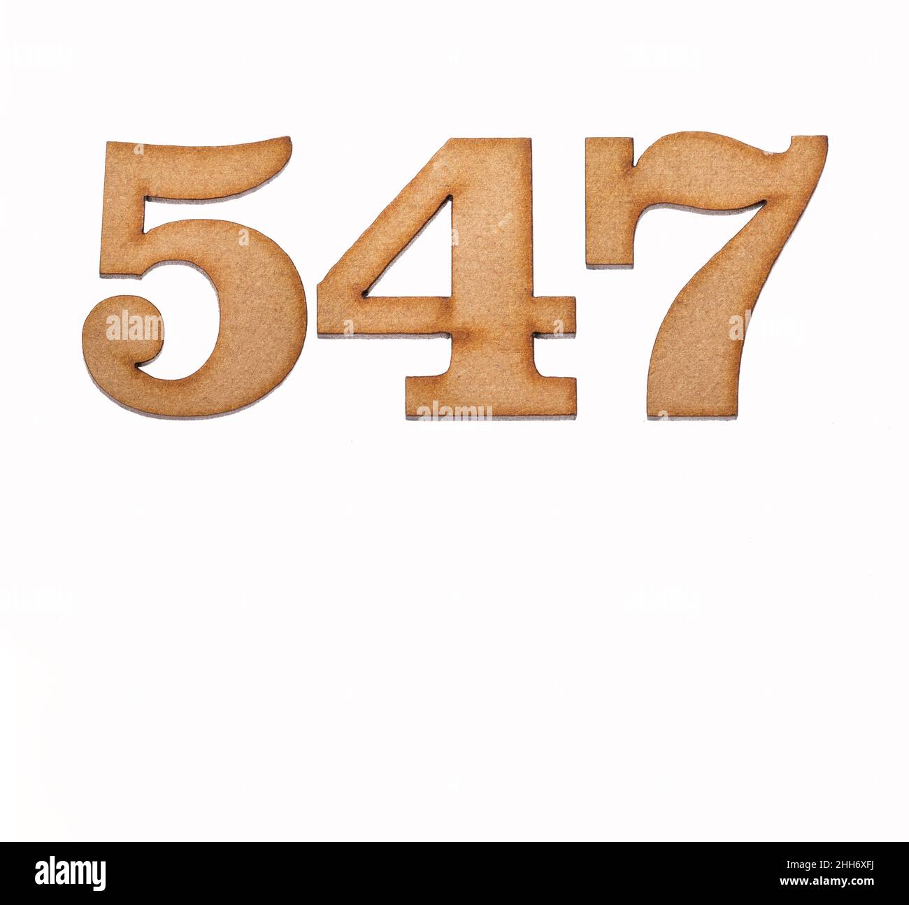 Number 547 in wood, isolated on white background Stock Photo - Alamy