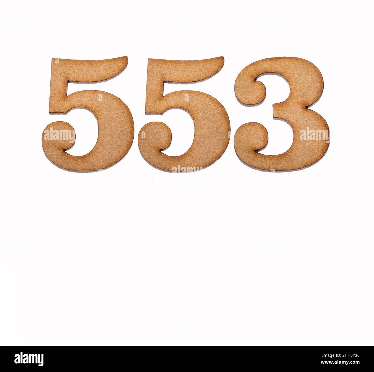 Number 553 in wood, isolated on white background Stock Photo - Alamy