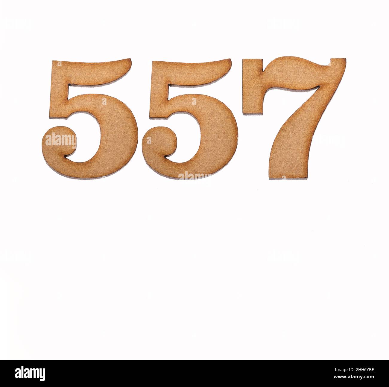 Number 557 in wood, isolated on white background Stock Photo - Alamy