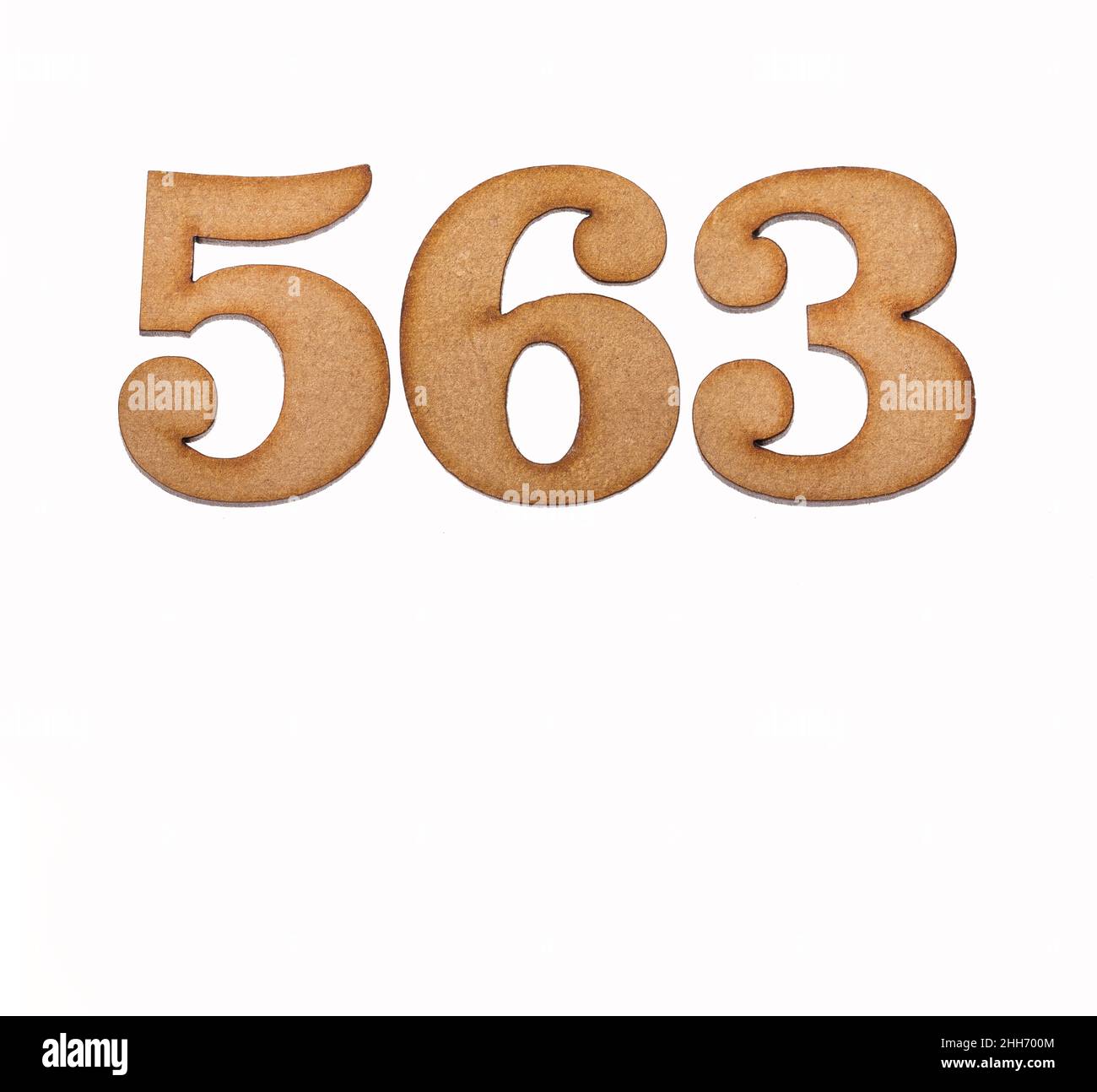 Number 563 in wood, isolated on white background Stock Photo - Alamy