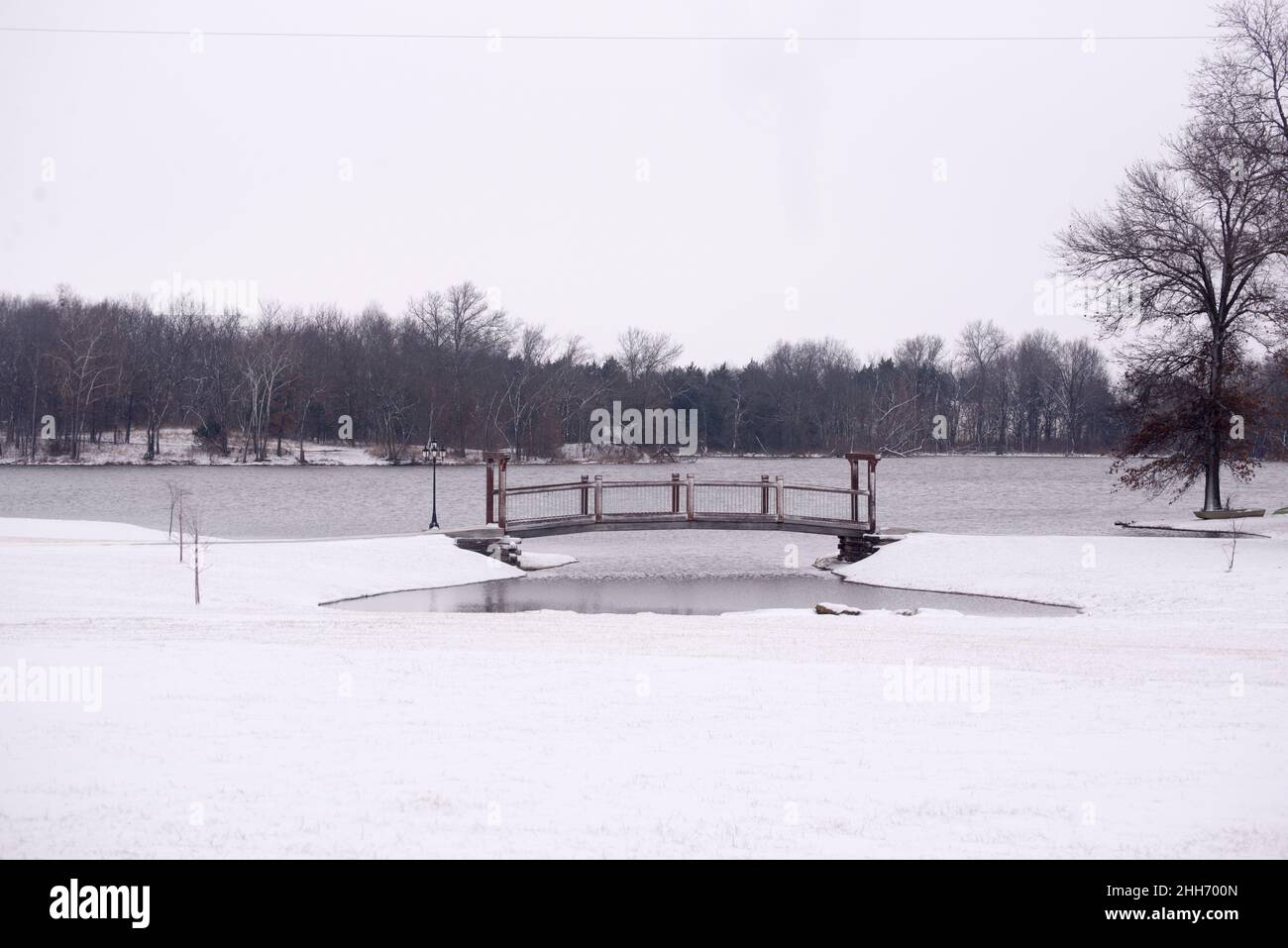 Winter Snow covered Bridge at the lake Stock Photo - Alamy