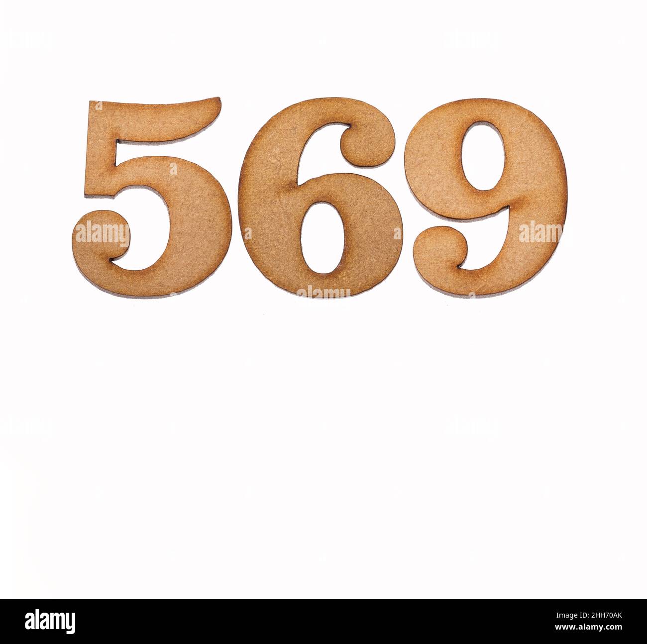 Number 569 in wood, isolated on white background Stock Photo - Alamy