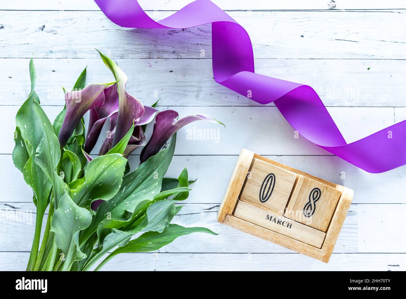 Purple Cala Lily bouquet and a date block for International Women's Day ...