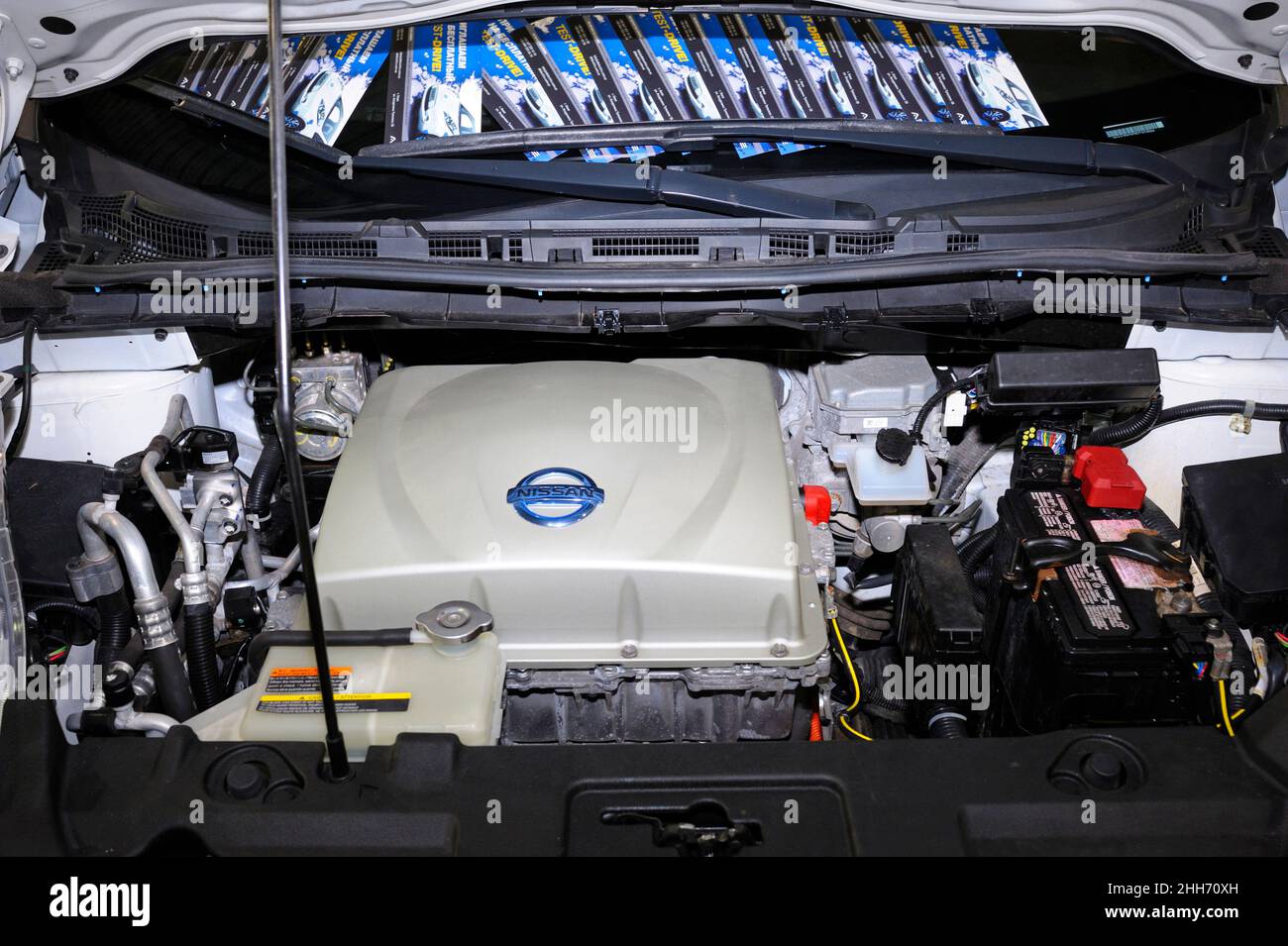Engine compartment of an electric car Nissan with engine and other car ...