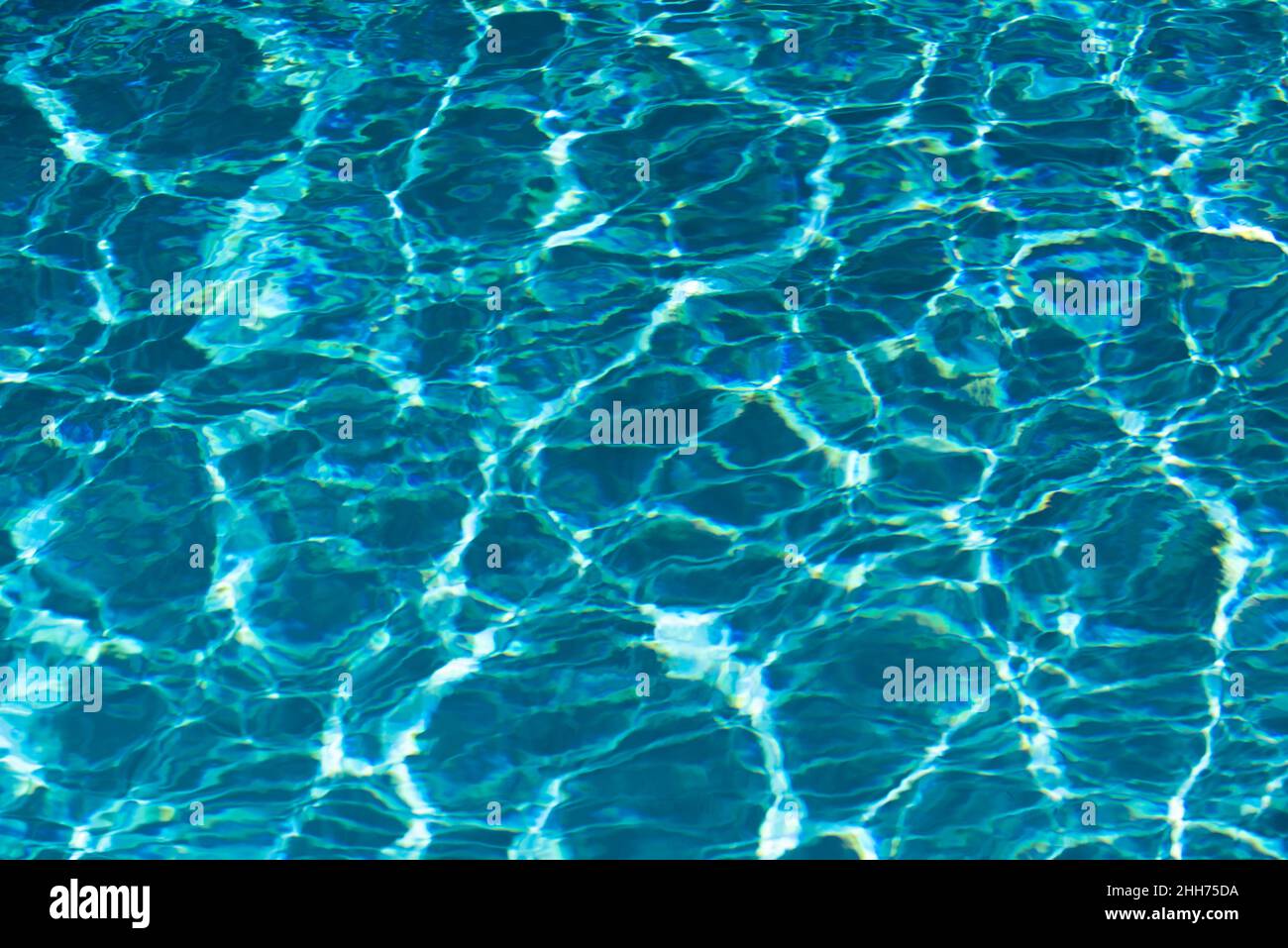 Ripple Water in swimming pool with sun reflection. Wavy water ...