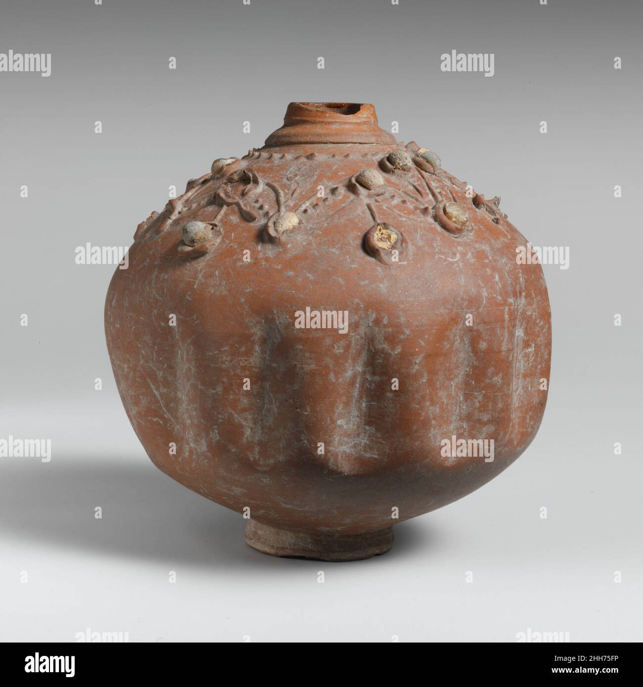 Terracotta flask 2nd century A.D. Roman On the shoulder is barbotine ...