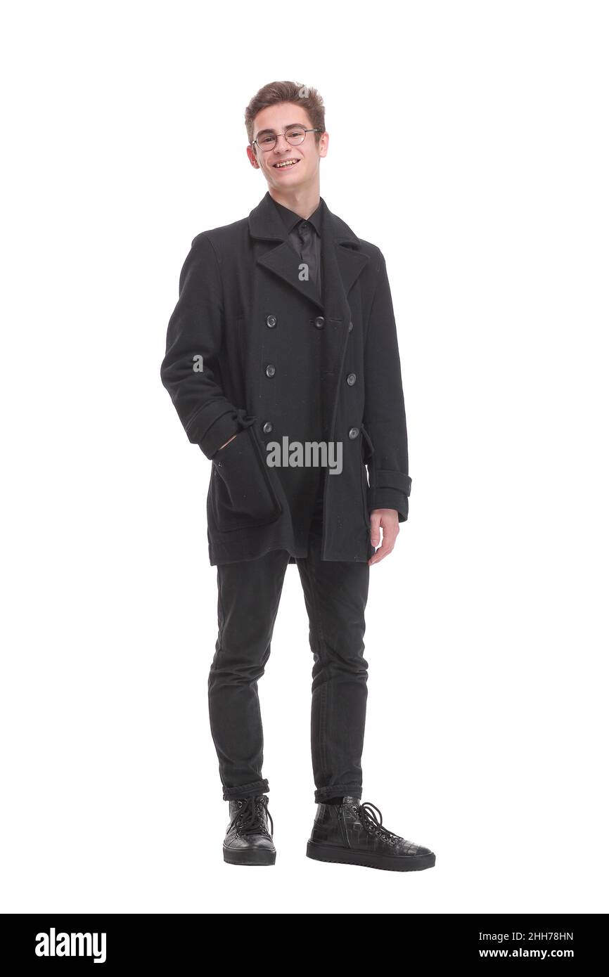 Fashion shot of a young handsome man in black coat. Studio shot ...