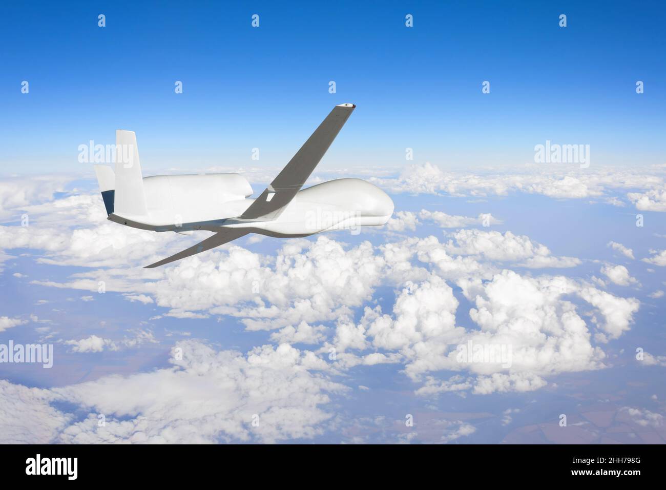 Unmanned aerial vehicle flying high in the sky above the clouds in the ...