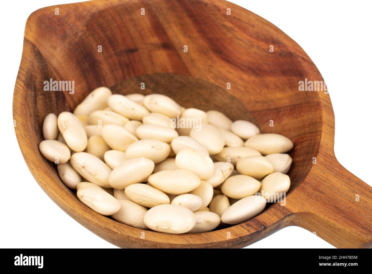 Lots of organic white beans with wooden cup, close-up, isolated on ...