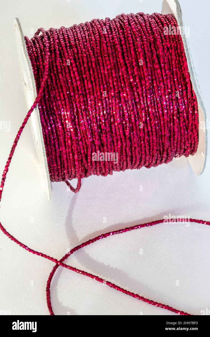 Spool of beaded yarn Stock Photo - Alamy