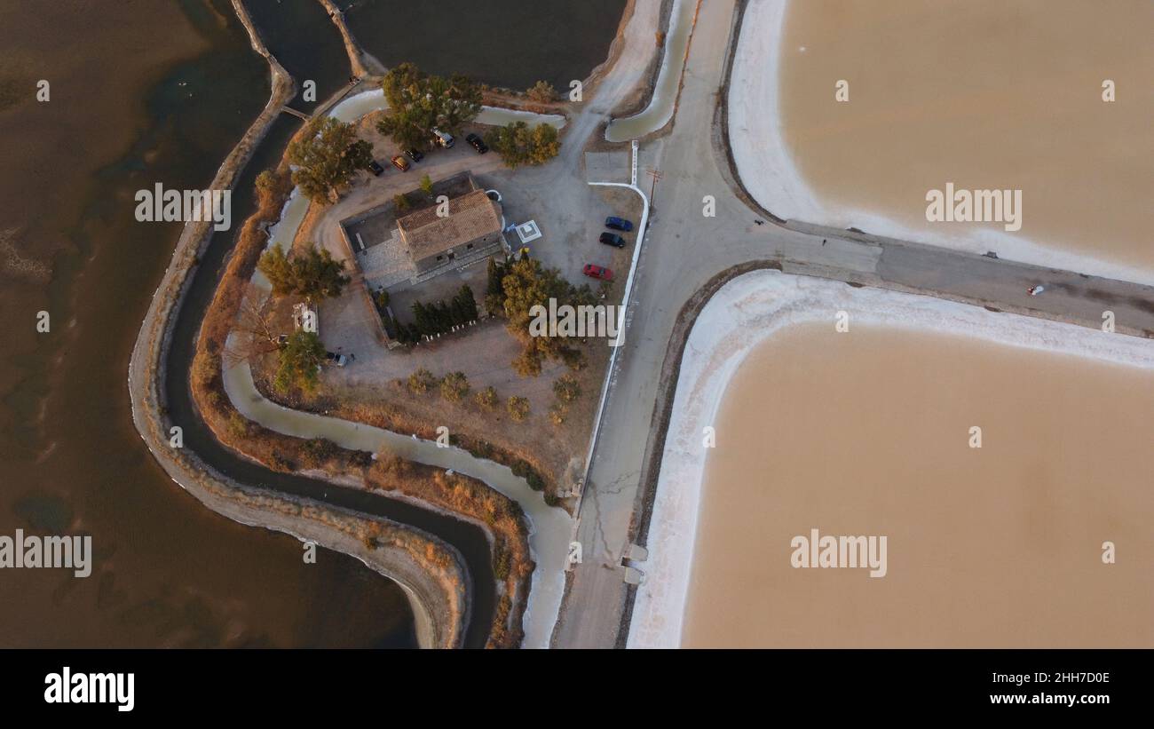 Aerial drone view of Mesologgi saltworks and Panagia Foinikia church in ...