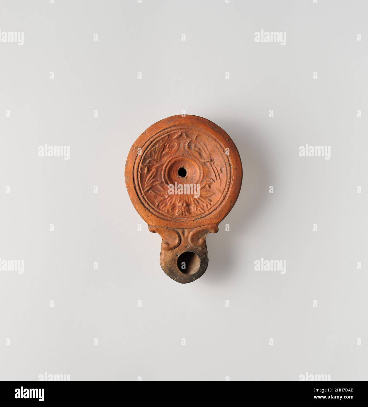 Terracotta oil lamp ca. A.D. 70–120 Roman Loeschcke Type 4. Mold-made ...