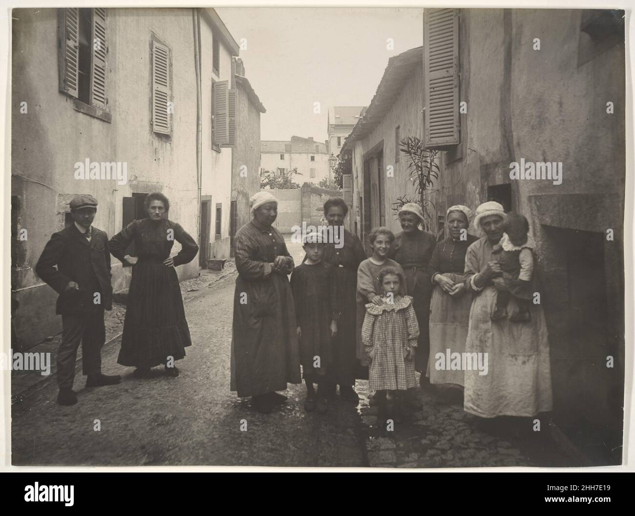 [Group of Adults and Children on a Village Street in the Auvergne] ca ...