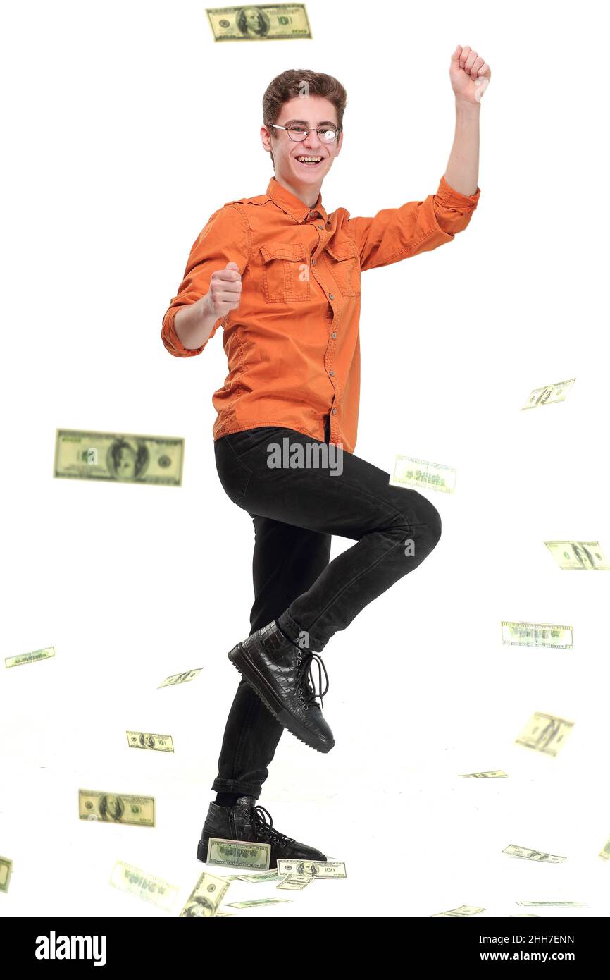 Happy young man enjoying rain of money, isolated on white background ...