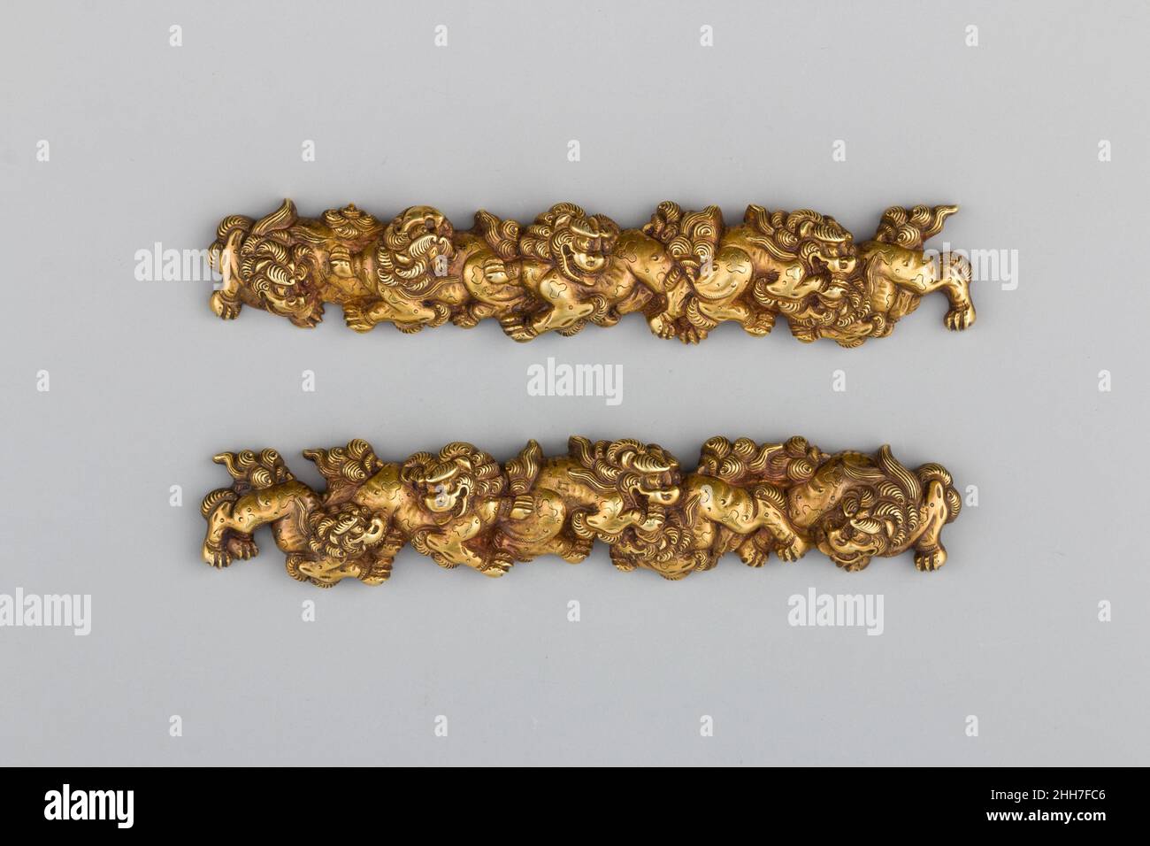 Pair of Sword-Grip Ornaments (Menuki) possibly early 17th century Japanese Menuki are a pair of ...