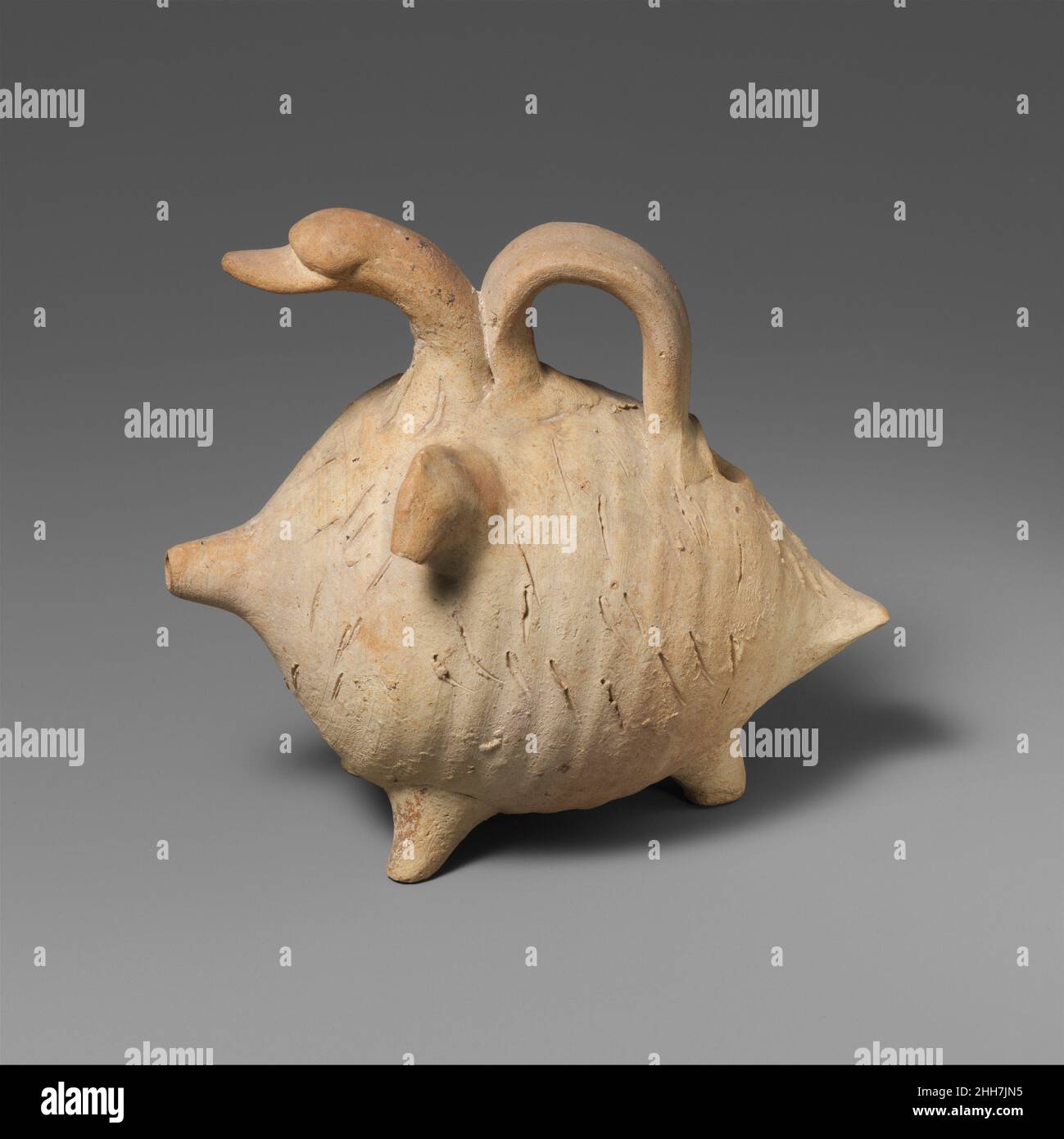 Terracotta duck-shaped askos (flask with spout and handle over the back ...