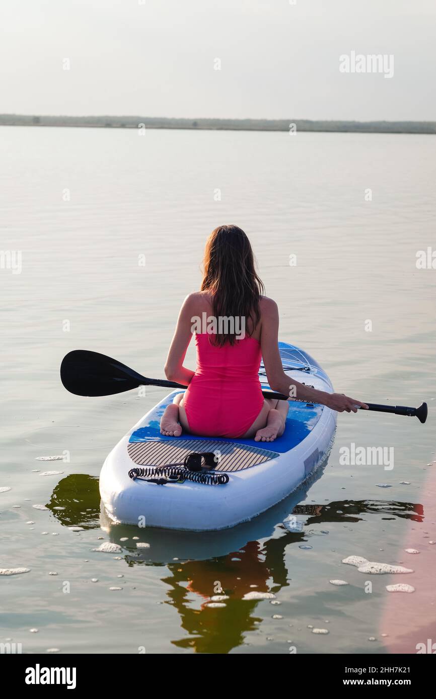 Woman paddle board hi-res stock photography and images - Alamy