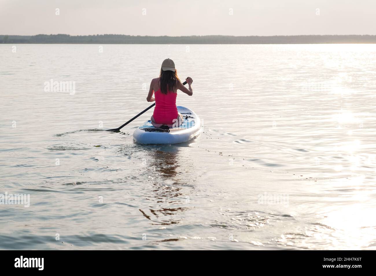 Woman paddle surf sunset hi-res stock photography and images - Alamy