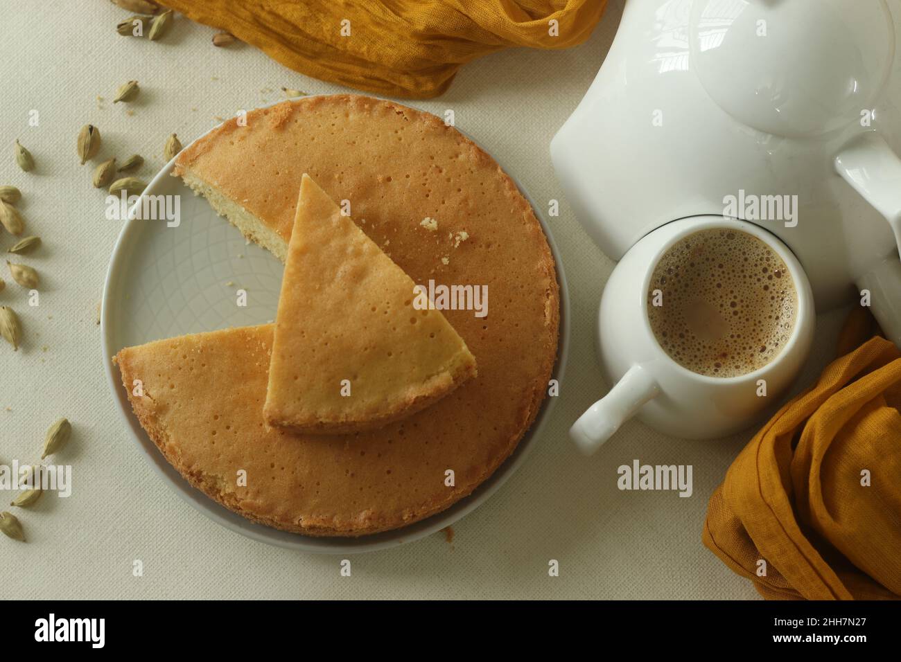 Slice of ghee cake. A version of tea cake with ghee and flavoured with ...