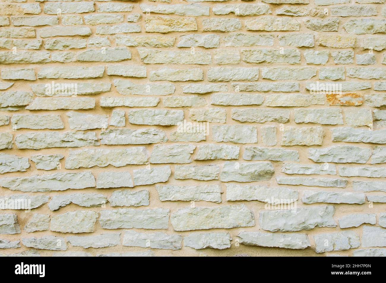 Fragment of ancient medieval fortress wall made of limestone. Vintage ...