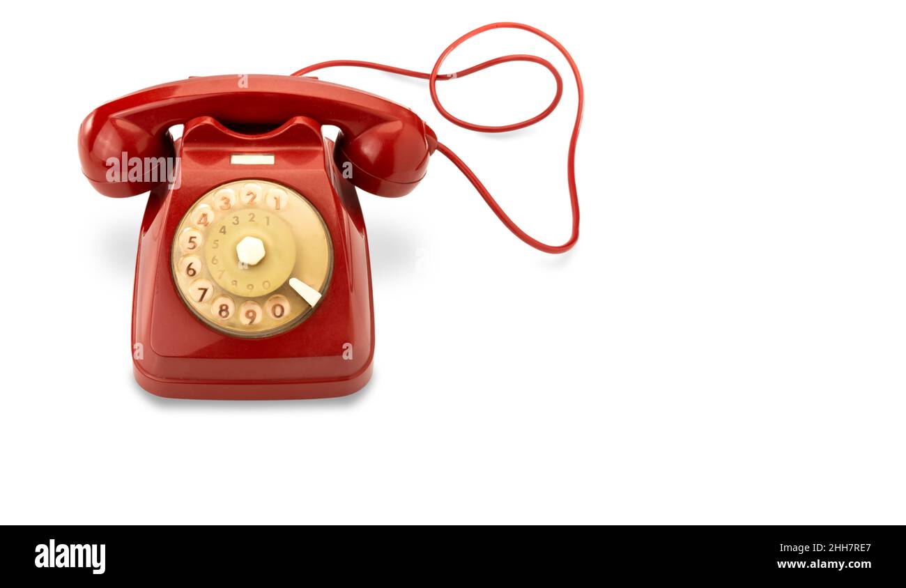 Old red rotating dial telephon isolated on white background in top view ...