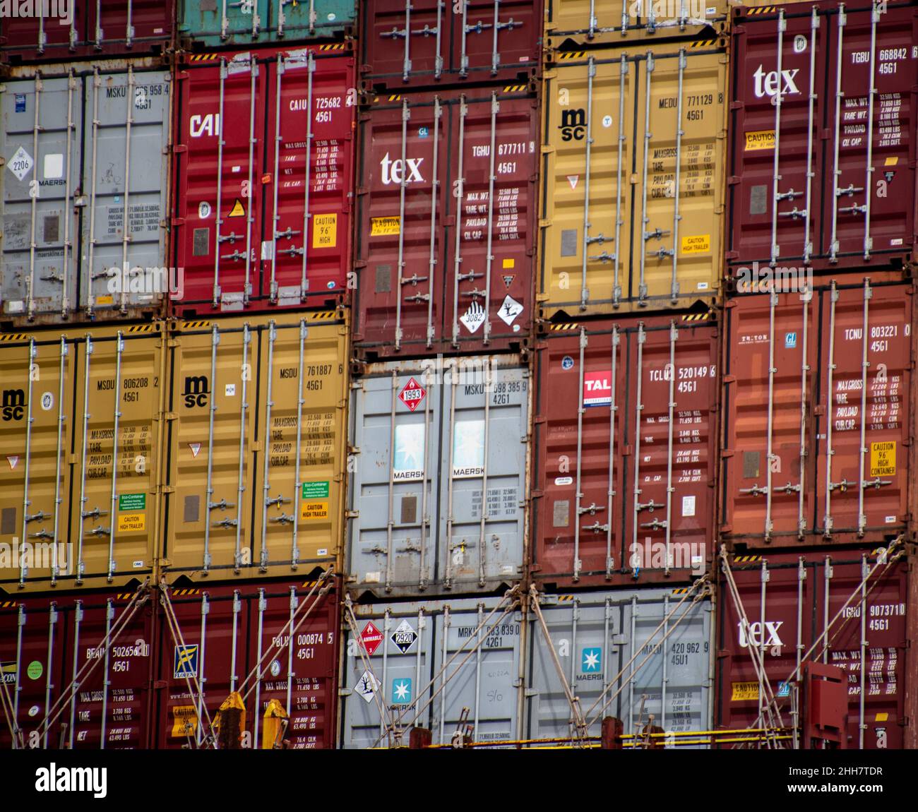 A wall of multi-colored steel shipping containers Stock Photo - Alamy