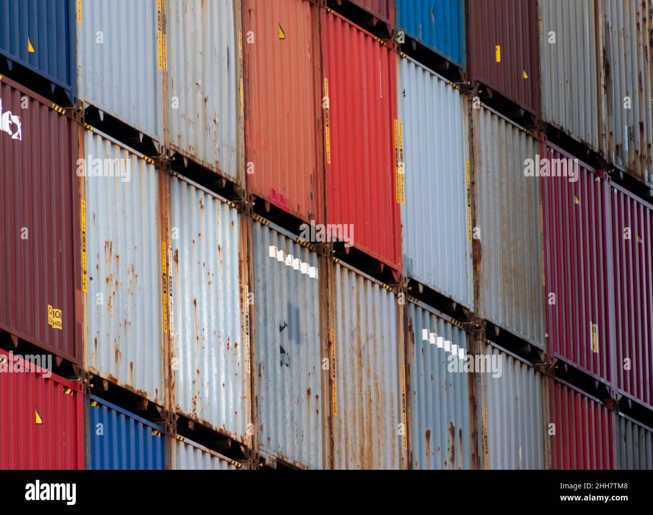 A wall of multi-colored steel shipping containers Stock Photo - Alamy