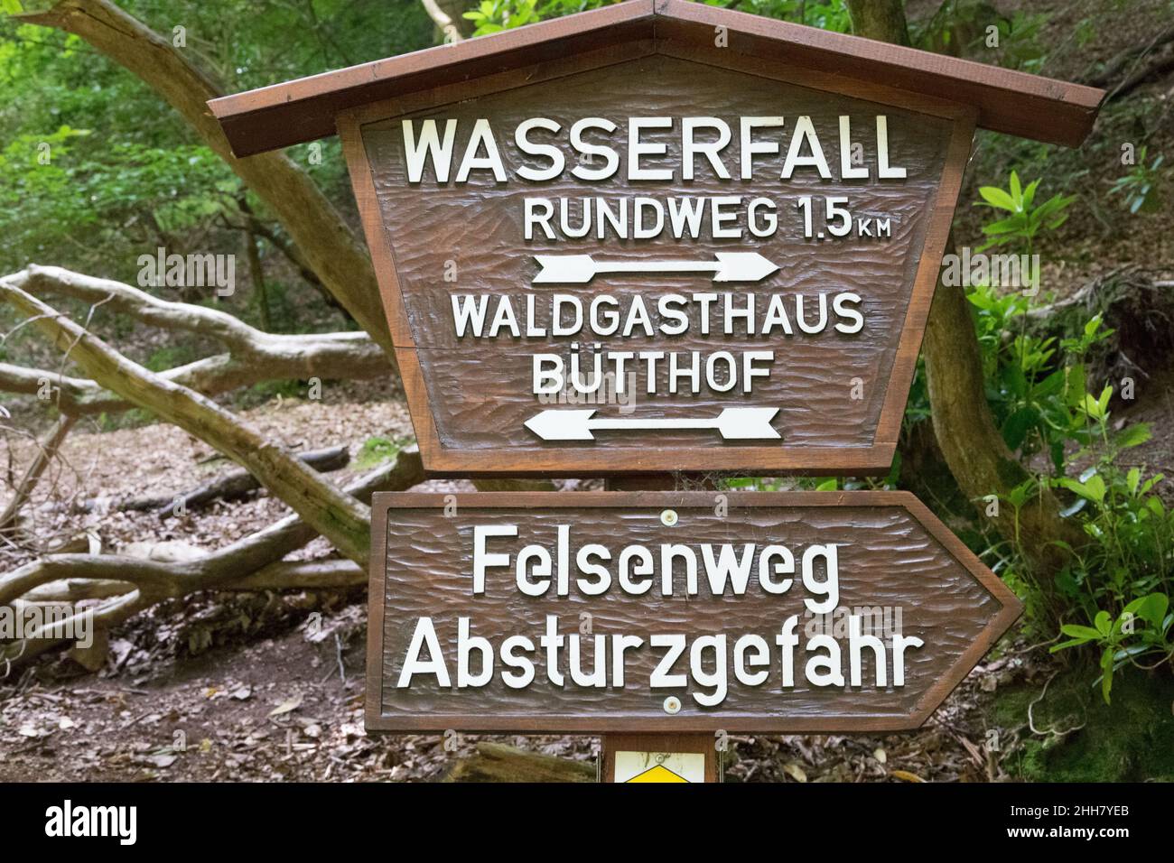 Sign shows waterfall direction and fall hazard warning Stock Photo - Alamy