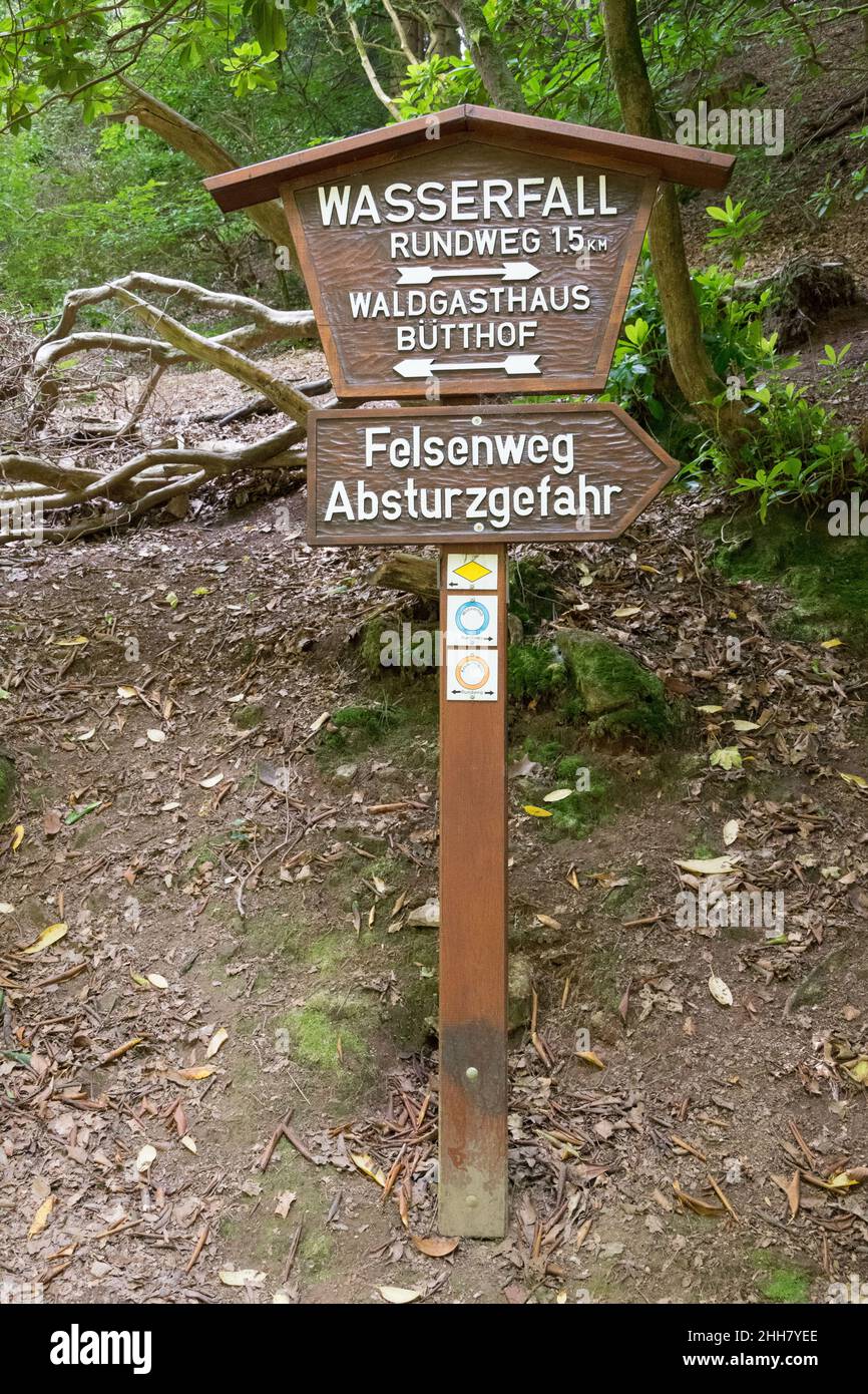 Sign shows waterfall direction and fall hazard warning Stock Photo - Alamy