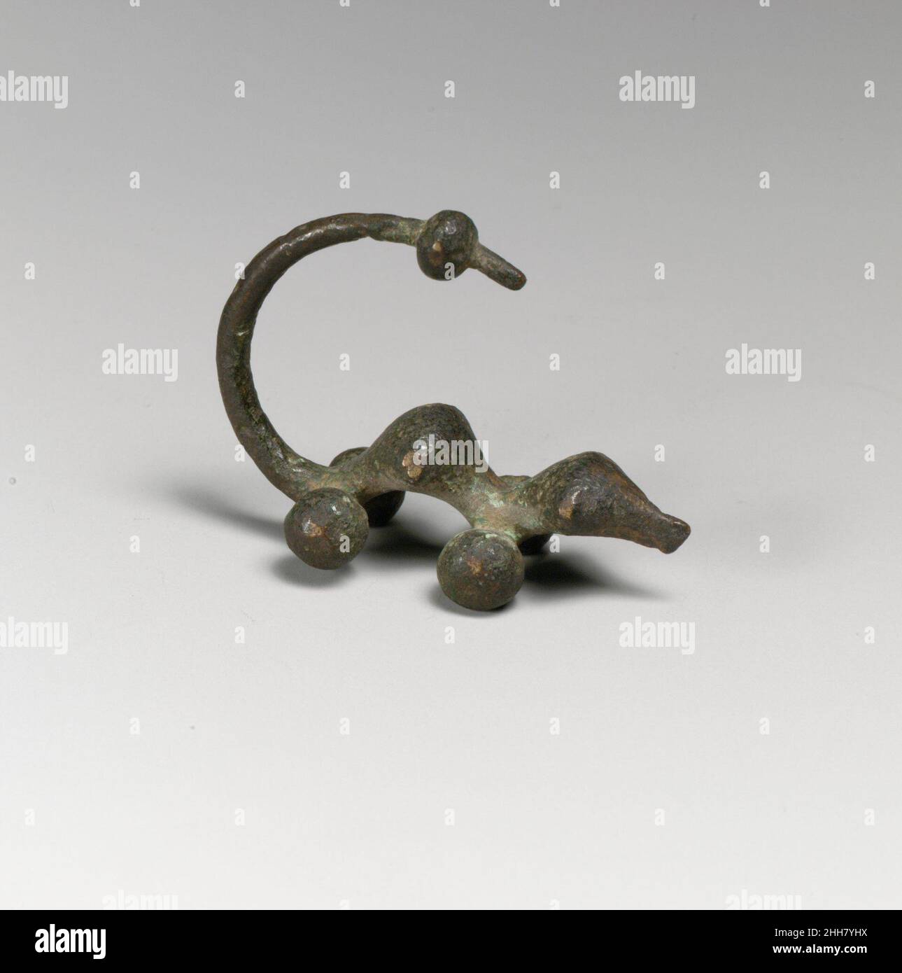 Fibula, serpentine type 7th century B.C. Italic The bow has two loops ...