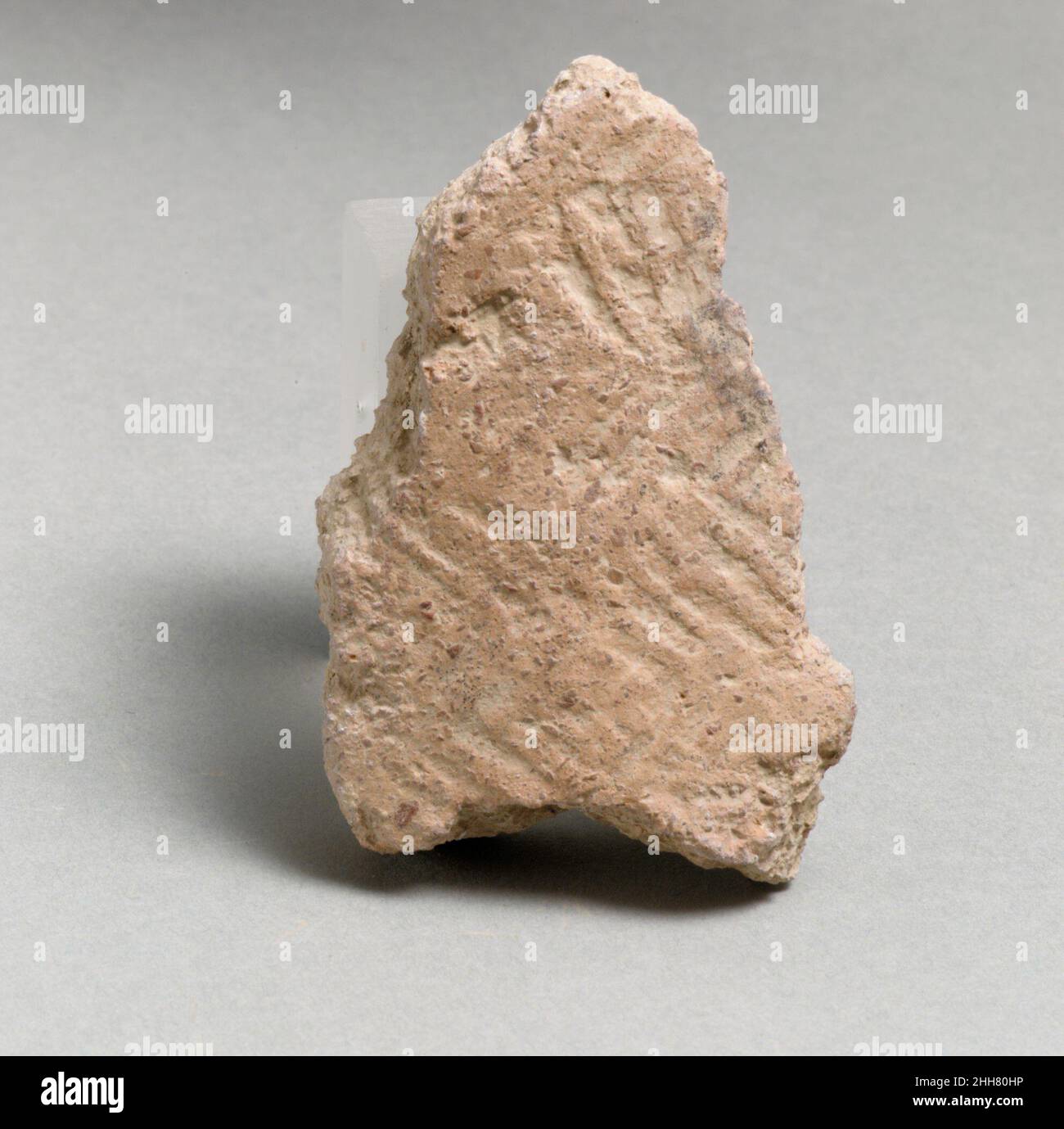 Terracotta fragment of a pithos (?) with impressed zigzag pattern ca ...