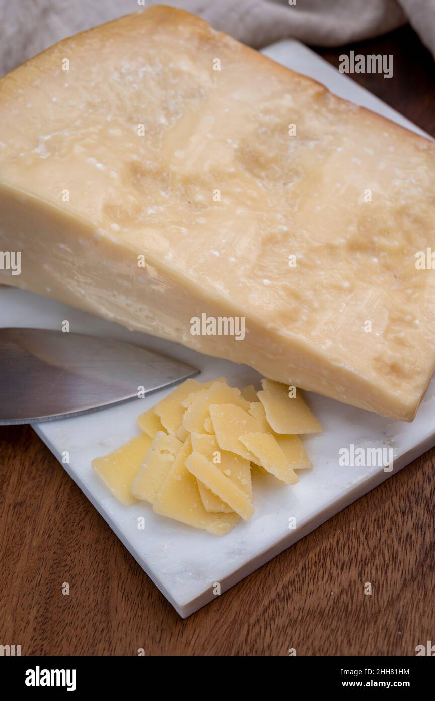 Flakes of parmesan cheese, italian hard parmigiano-reggiano cheese from ...