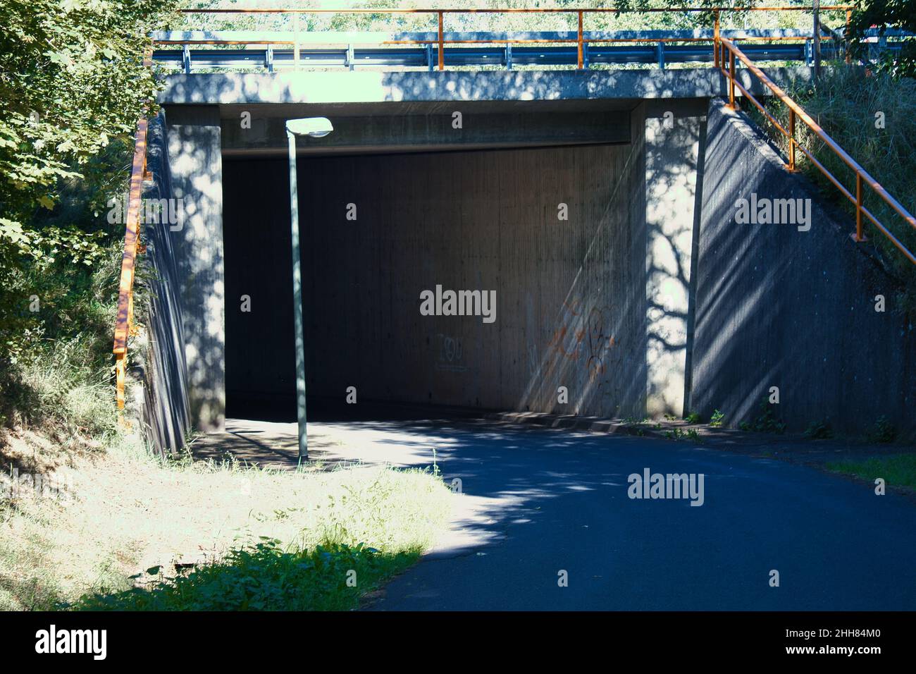 Tunnel entrance under the highway Stock Photo - Alamy