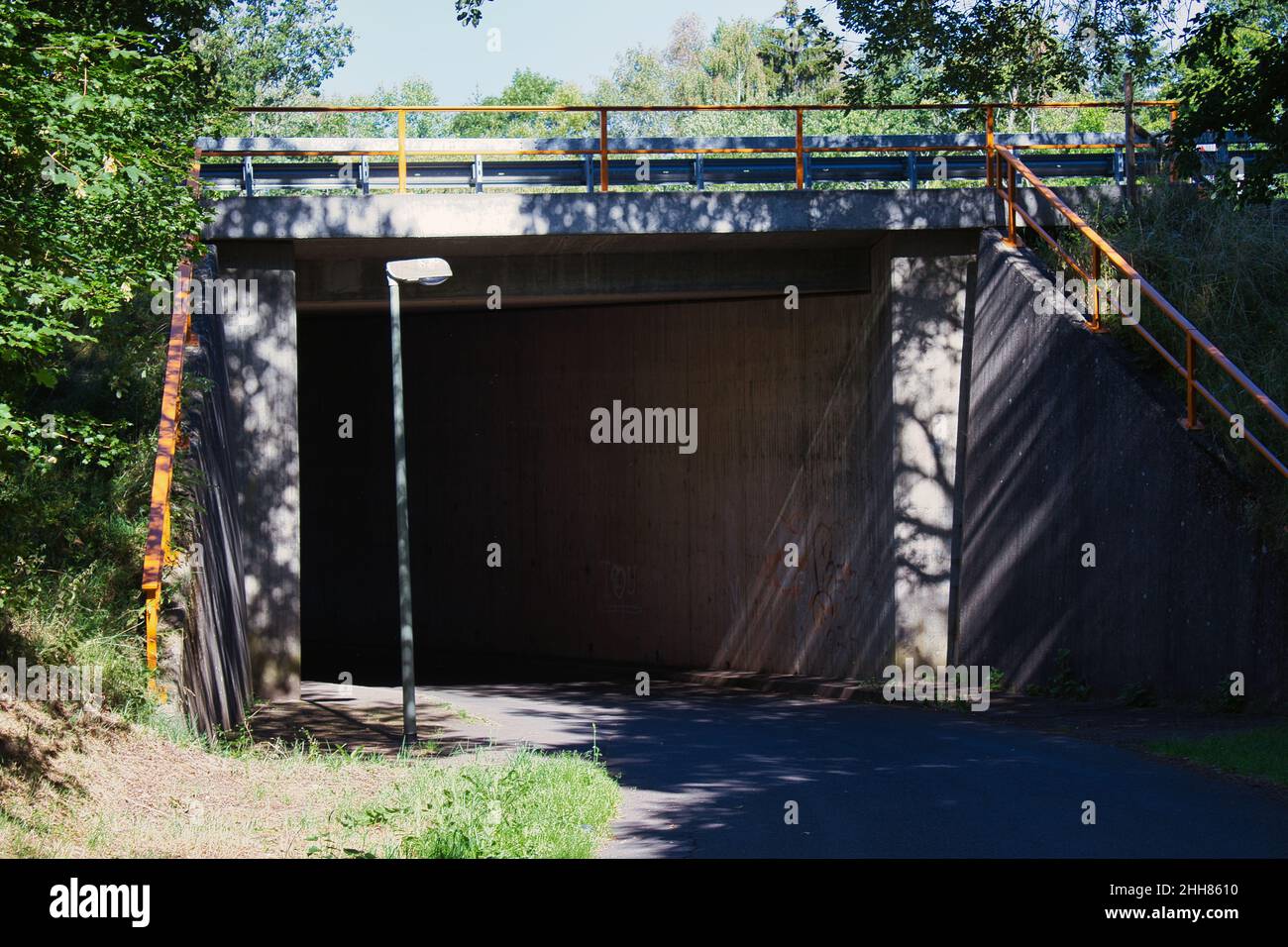 Tunnel entrance under the highway Stock Photo - Alamy