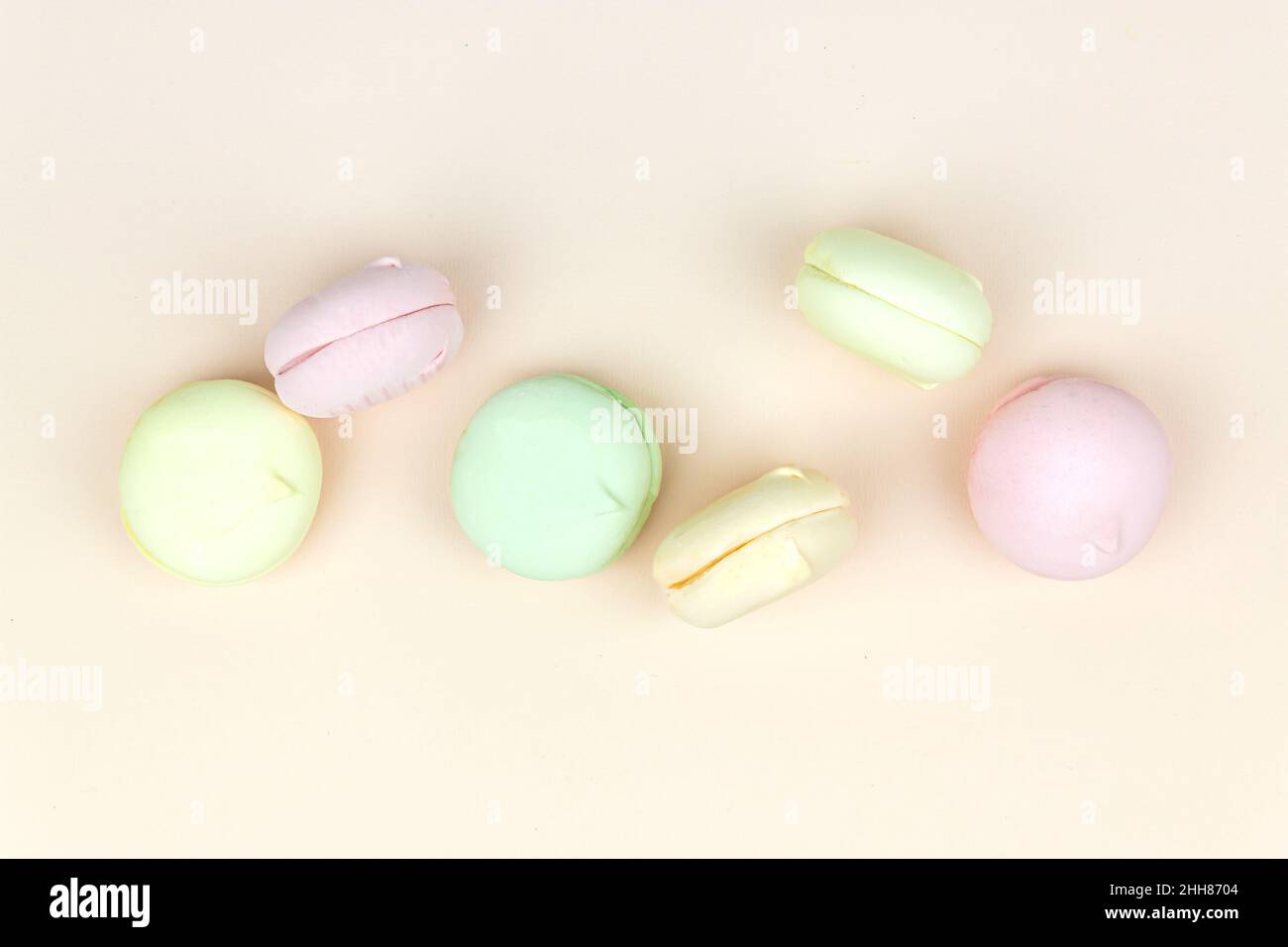 Marshmallow looks like macaroons on a pastel background, top view, flat ...