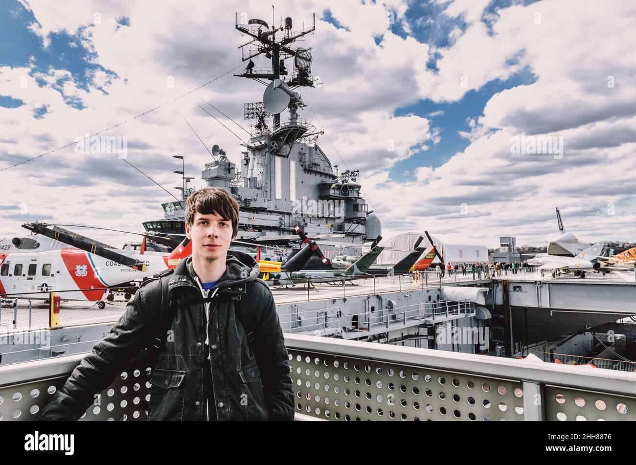 Young adult man with brown hair and beard standing on the top of ...