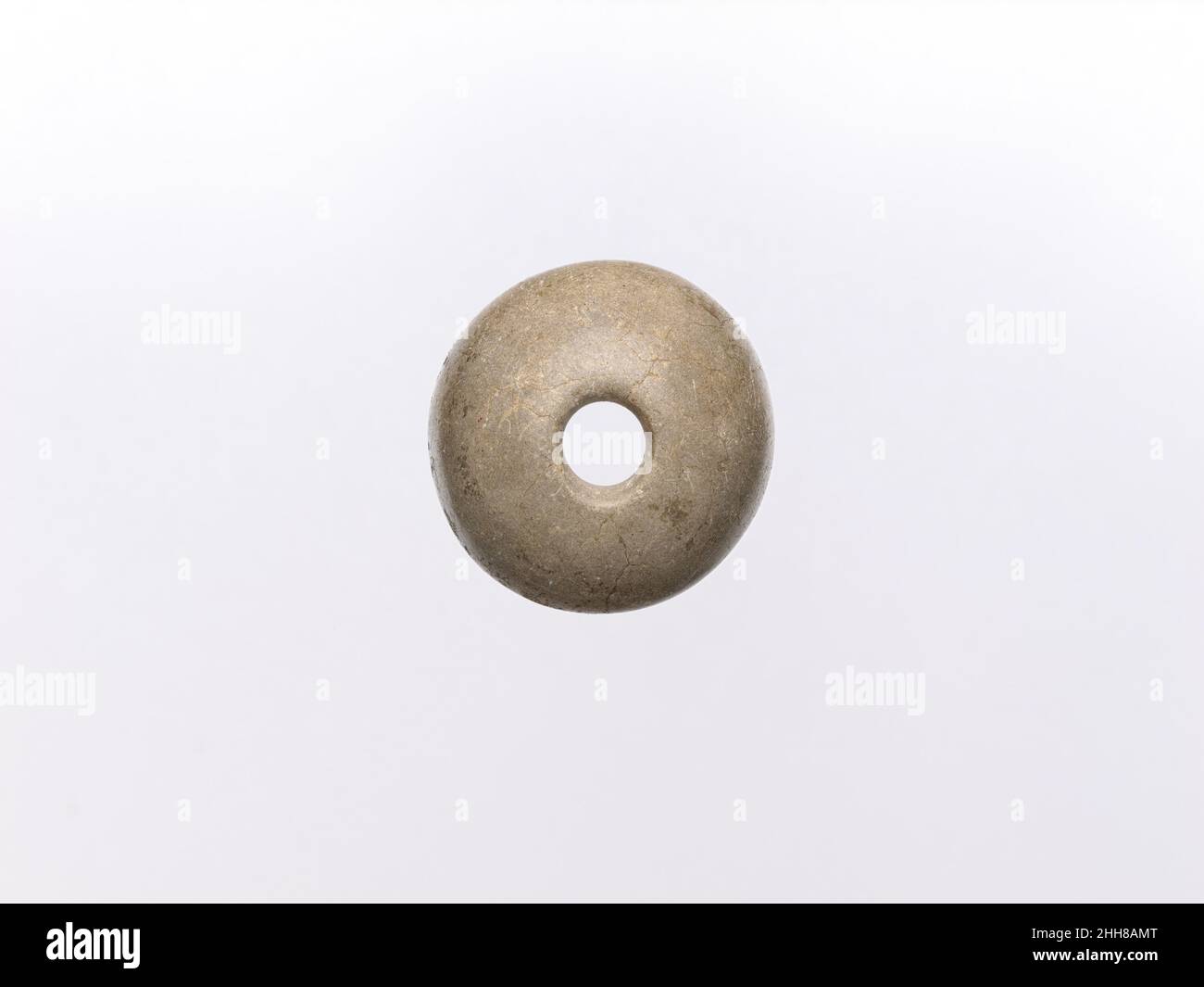 Spindle whorl n.d.a.. Spindle whorl. n.d.a.. Stone, gray. Mesopotamia ...