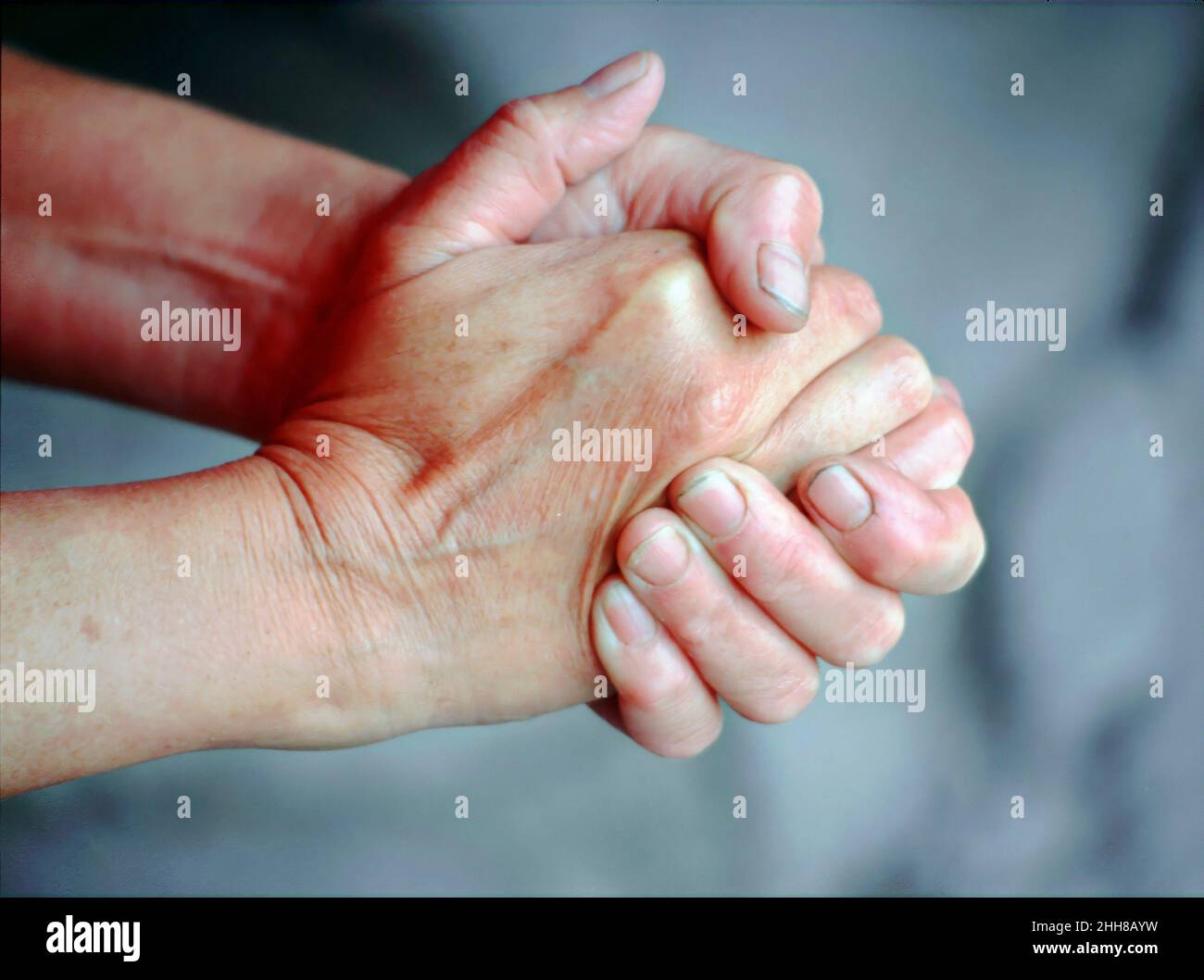 Folded hands with fingers Stock Photo - Alamy