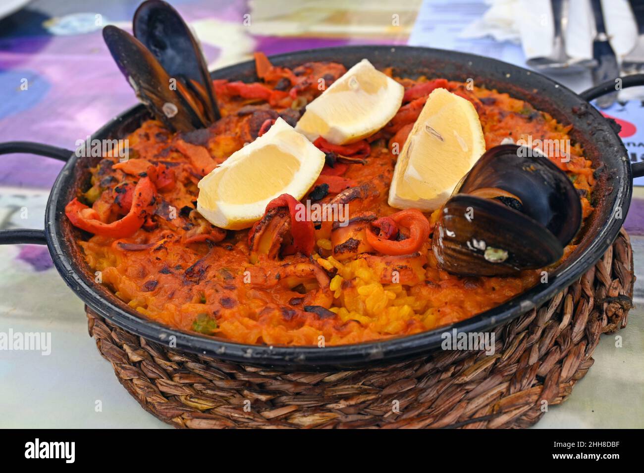 Spanish rice specialty, seafood Paella with lemon Stock Photo - Alamy