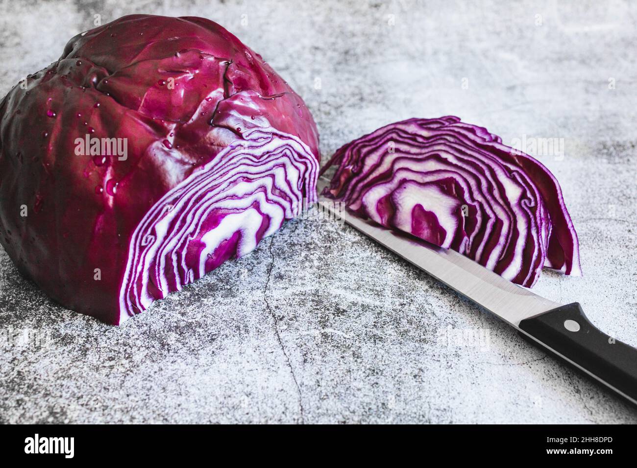 Sliced raw red cabbage with a kitchen knife Stock Photo - Alamy