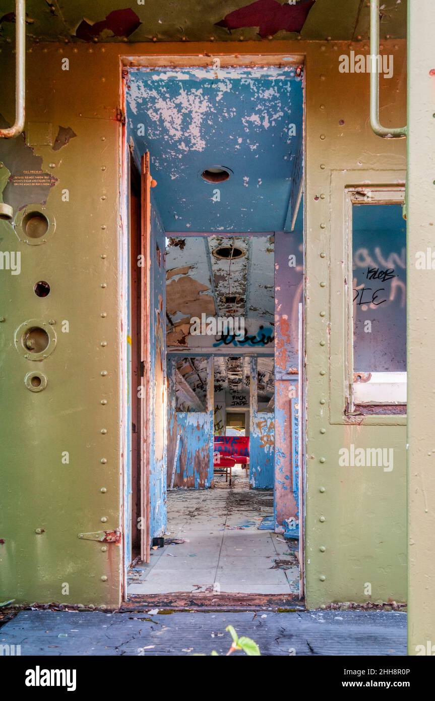 Vandalised remains of old train carriage - part of the Trinity Loop ...