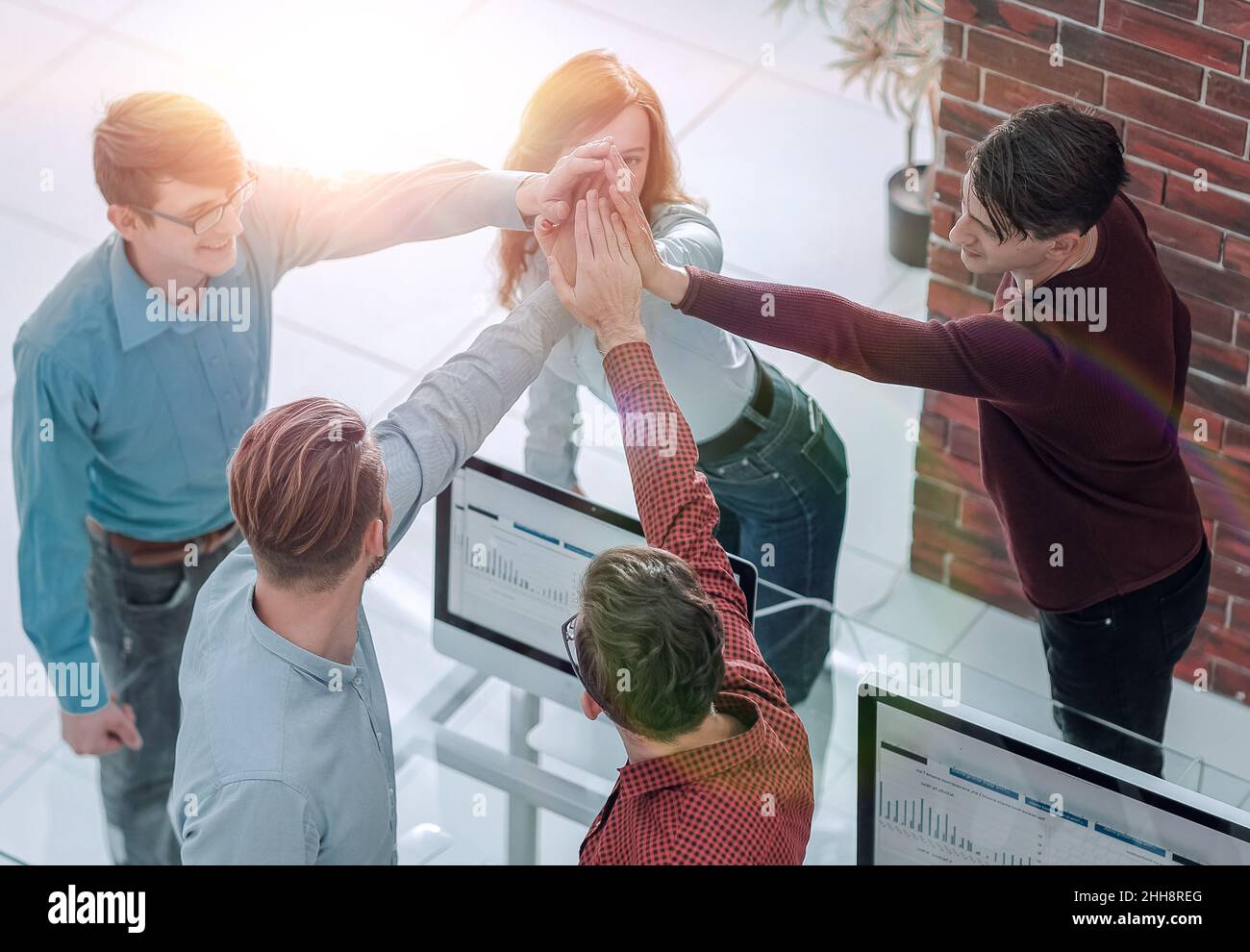 Business people giving five after signing agreement or contract Stock ...