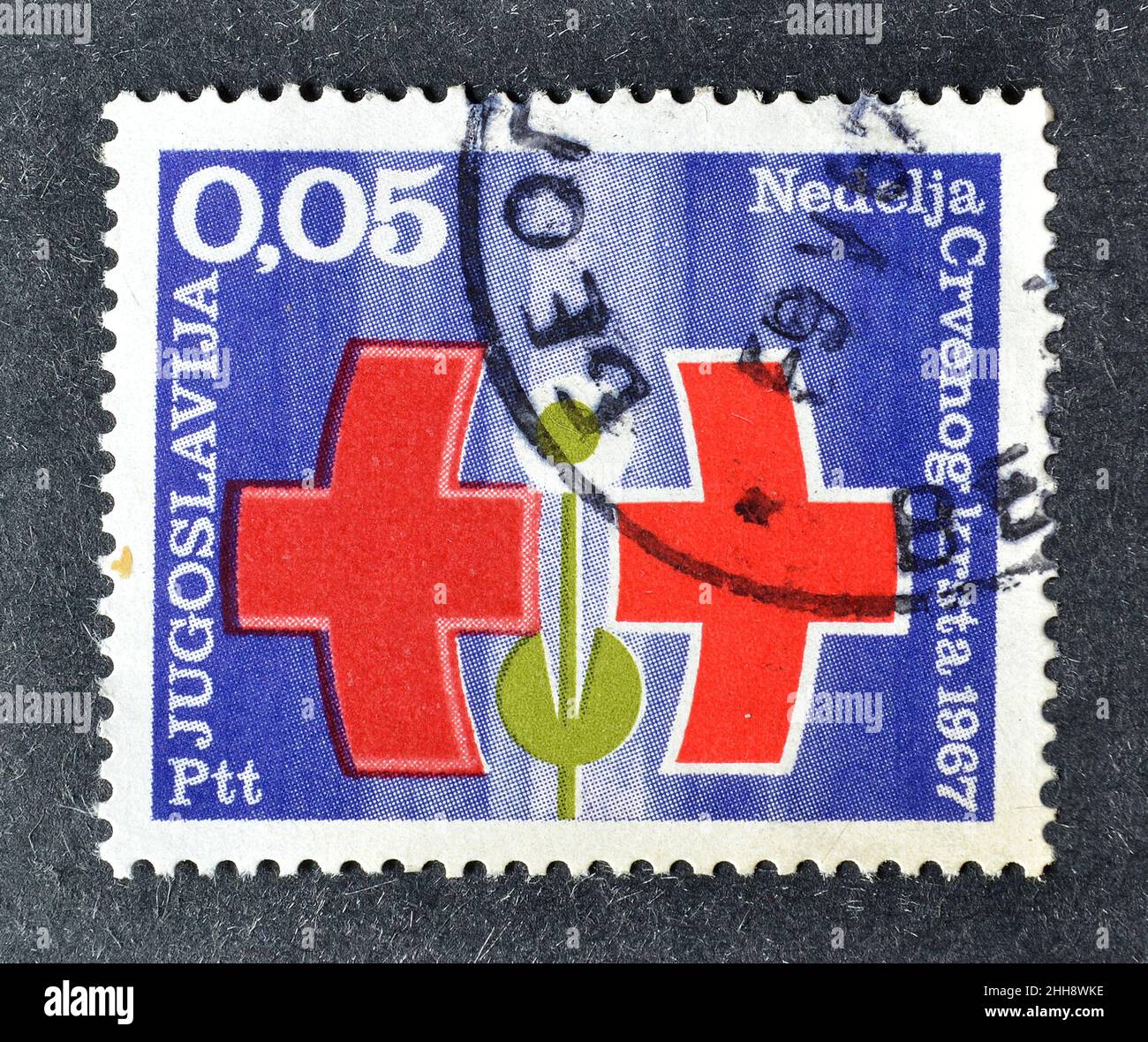 Cancelled postage stamp printed by Yugoslavia, that shows Charity stamp ...
