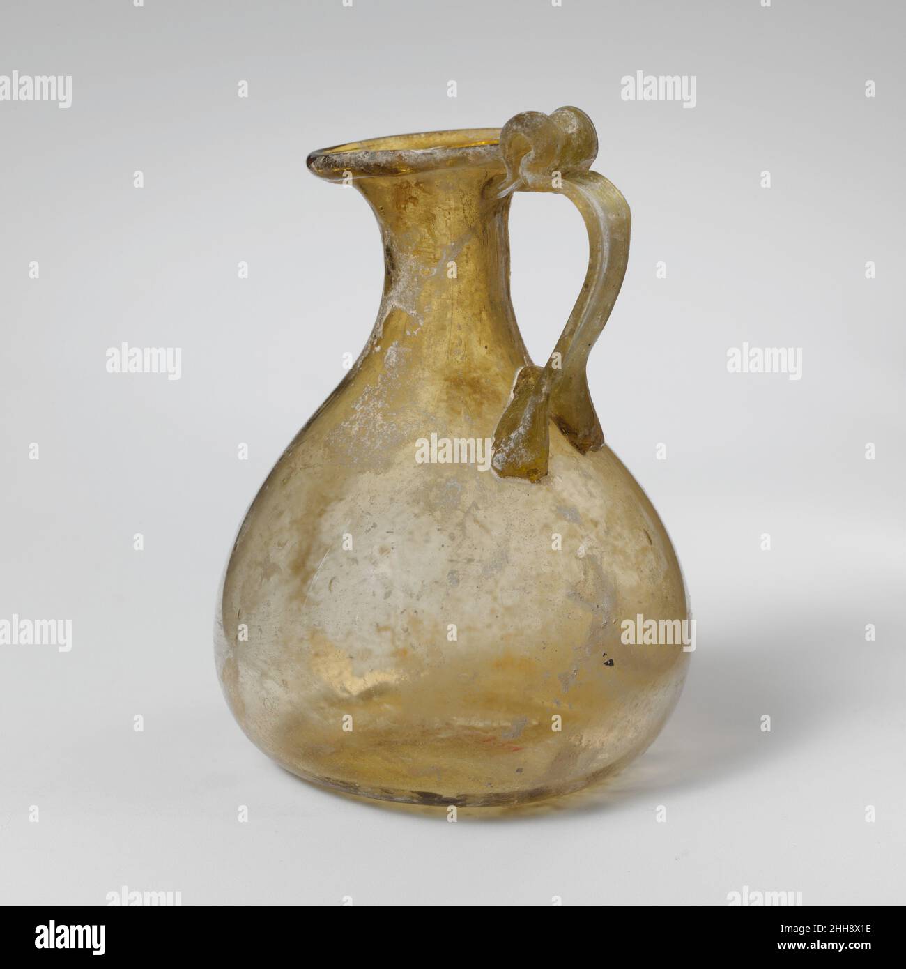 Glass jug mid-1st–2nd century A.D. Roman Small one-handled ...