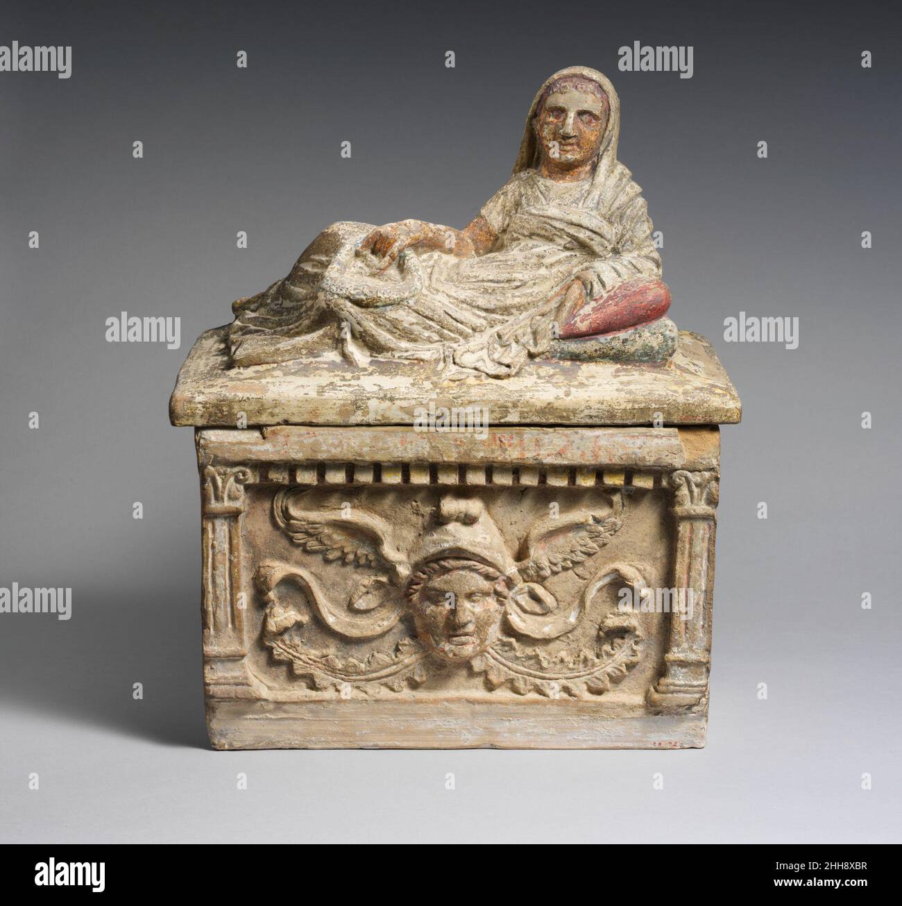 Terracotta cinerary urn 2nd century B.C. Etruscan The container depicts ...